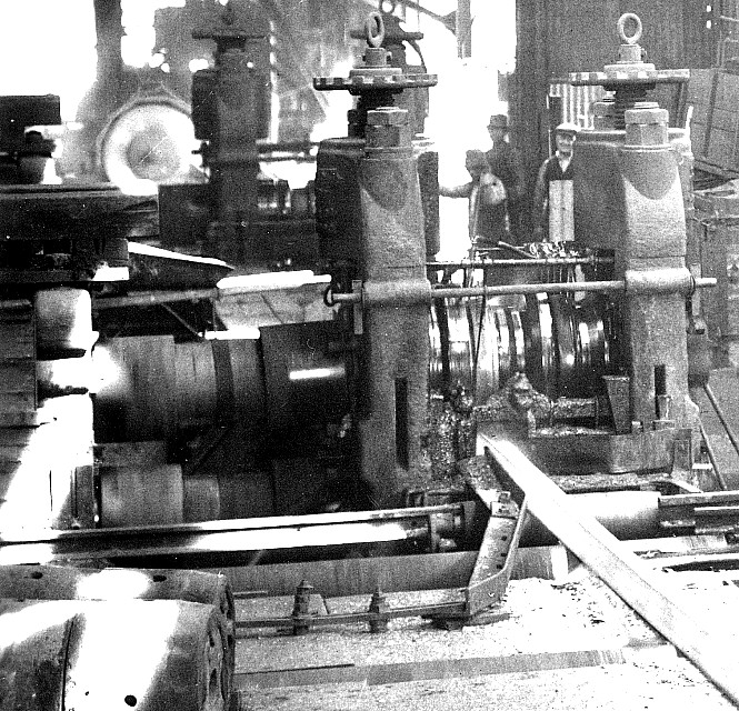 Hot rail receiving its first pass - Detail of roll stands